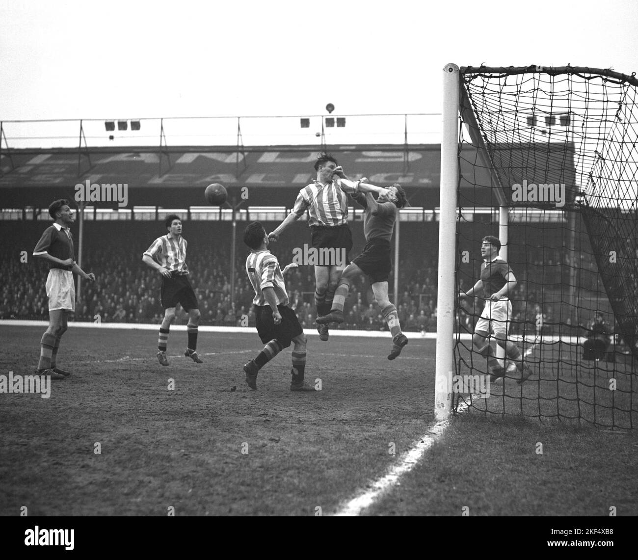 Shrewsbury goalkeeper Crossley appears to be giving Brentford's Jim ...