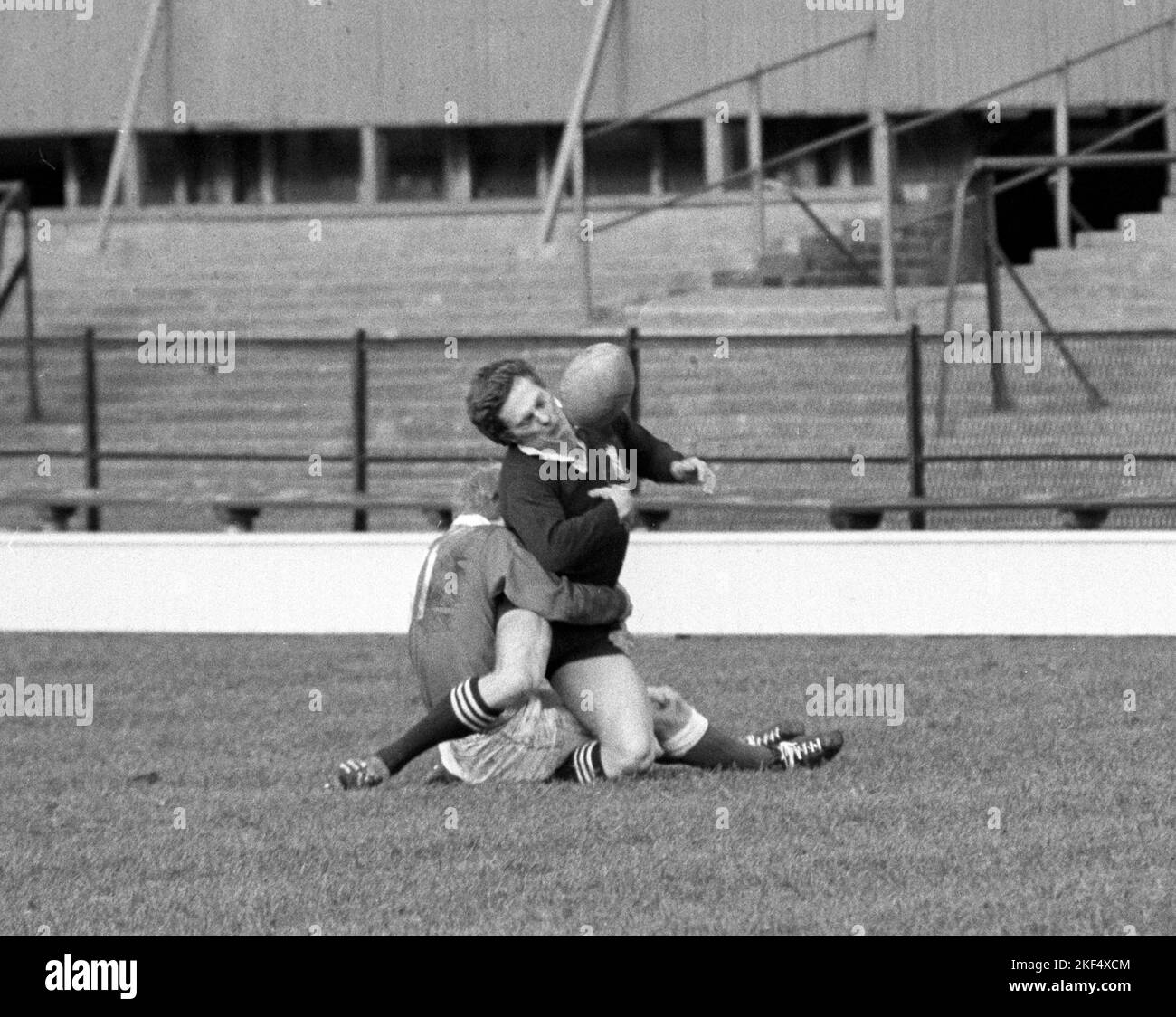 L/Cpl Morgan (Army) in a tackle with Sub.Lt. G. Phillips (Navy Stock ...