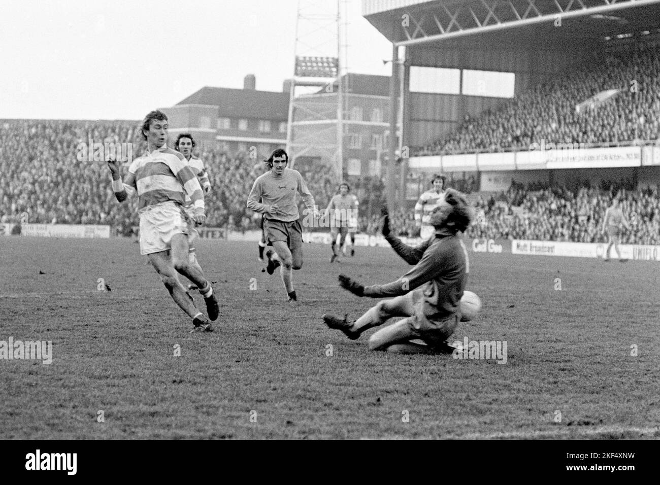 Queens Park Rangers' Dave Thomas (l) slides his team's first goal past ...