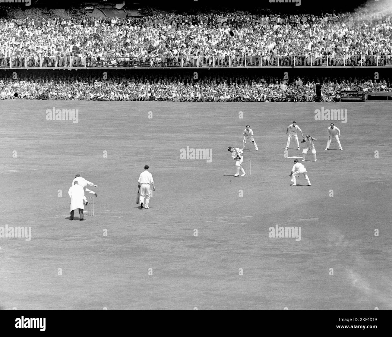 England's Wally Hammond (fourth l) plays a ball from Australian ...