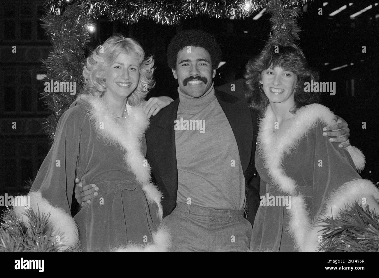 Daley Thompson turning on the Oxford Street Christmas lights, assisted ...