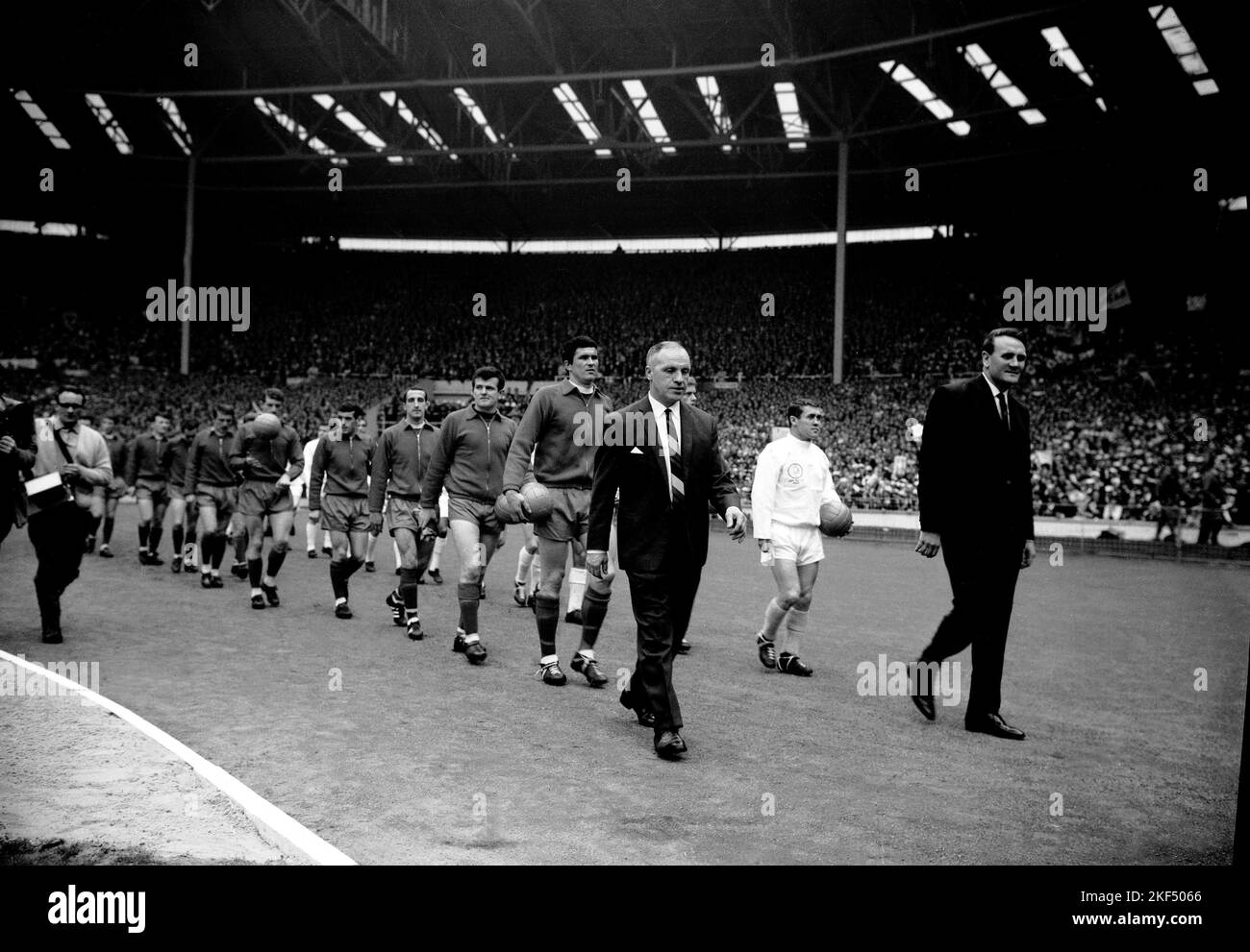 The two teams walk out at Wembley before the match: (r-l) Leeds United ...