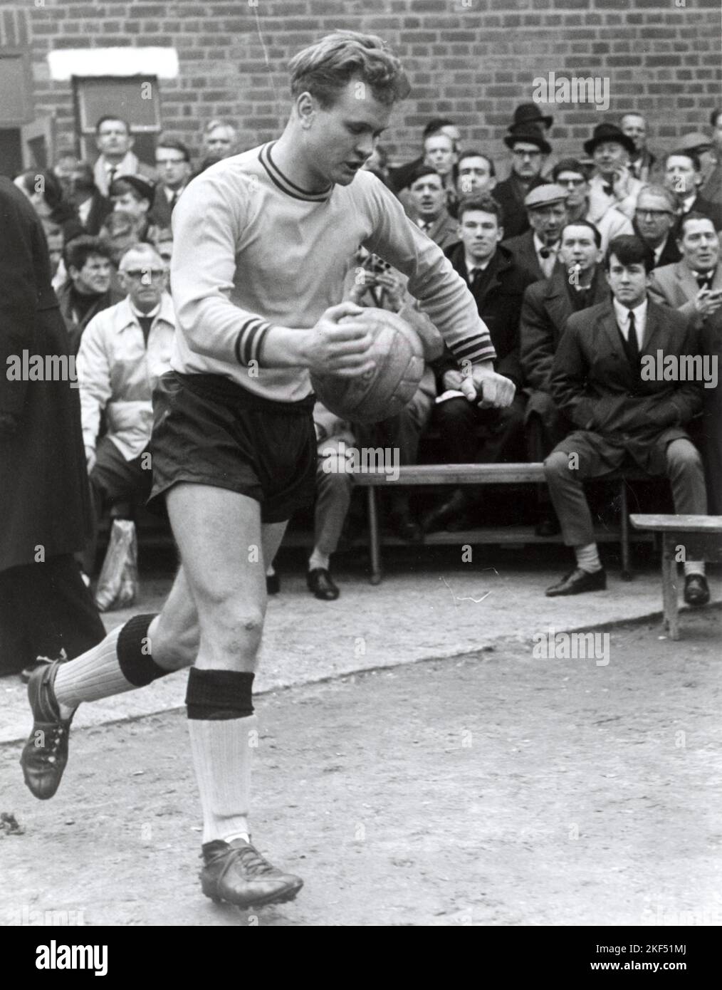 Oxford United captain Ron Atkinson leads his team out for their sixth ...