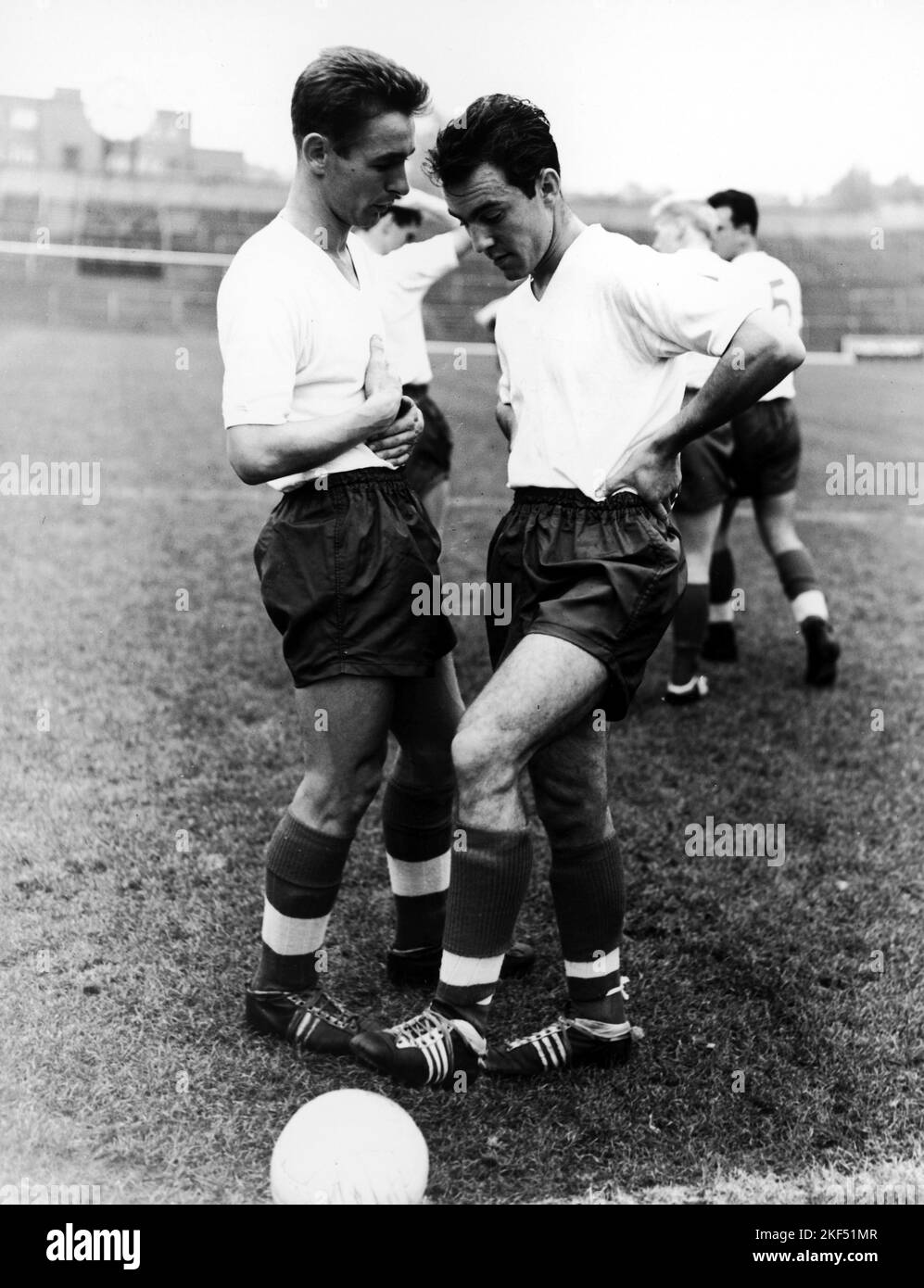 (L-R) England's Brian Clough has a quiet word with fellow striker Jimmy ...