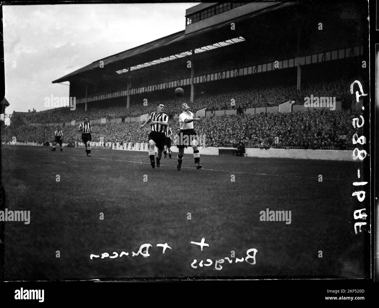 Newcastle United's John Duncan (l) and Tottenham Hotspur's Ron Burgess ...