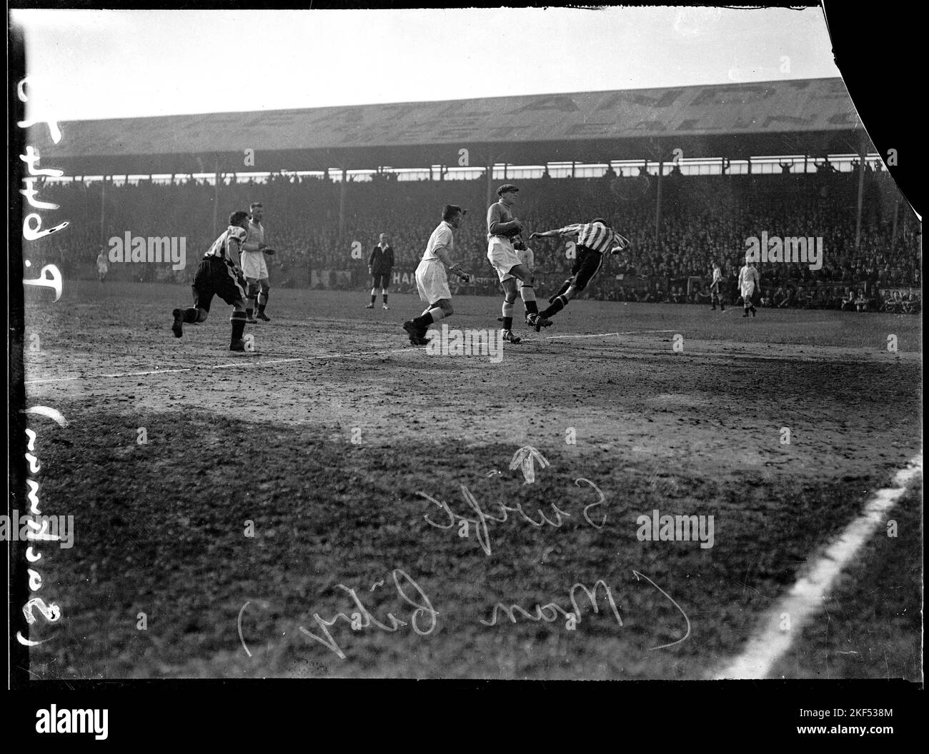 Manchester City goalkeeper Frank Swift (second r) claims the ball Stock ...