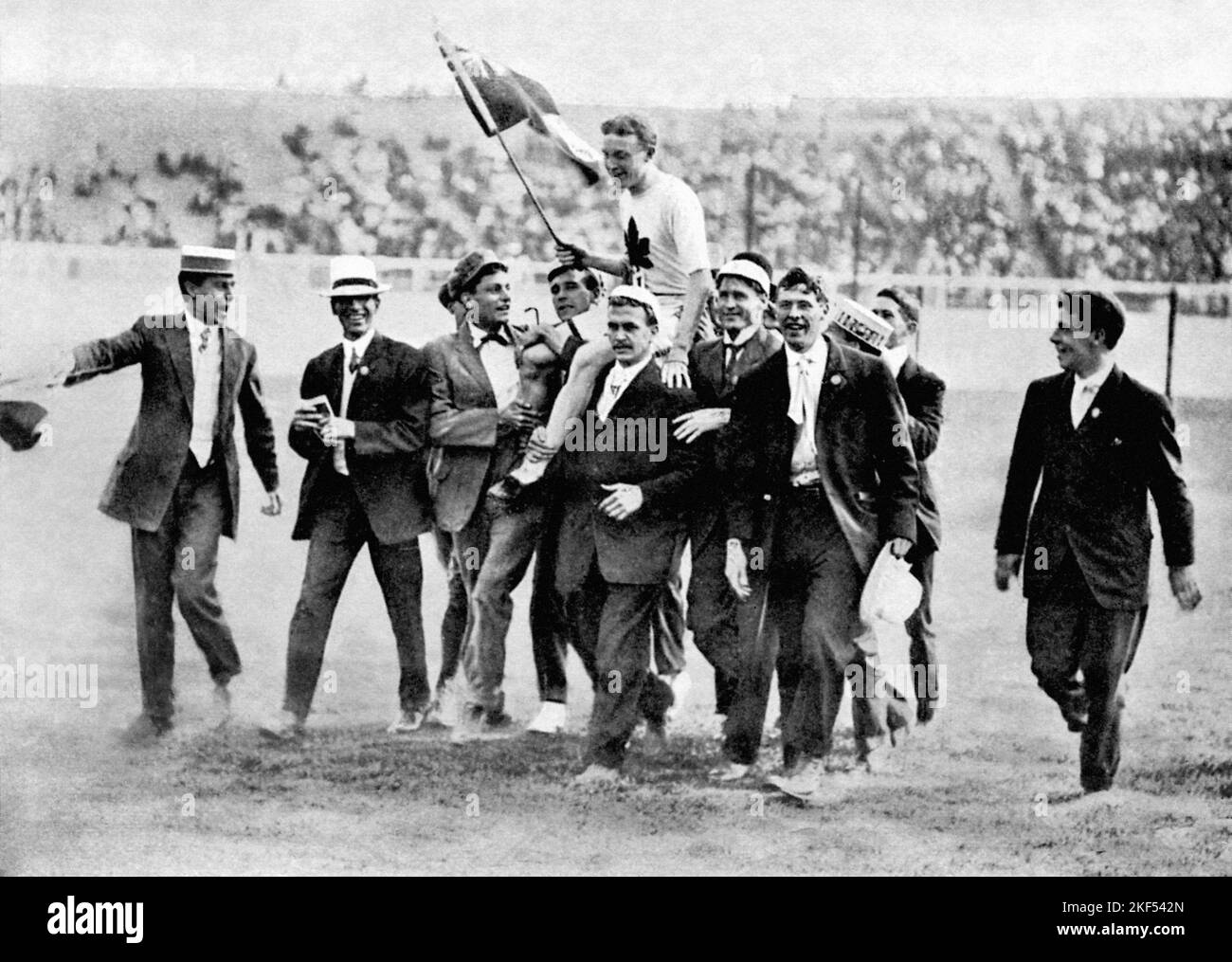 Canada's Robert Kerr is carried across the stadium after winning gold ...