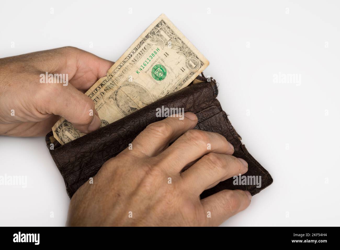 Poor pensioner torn wallet with one dollar Stock Photo - Alamy