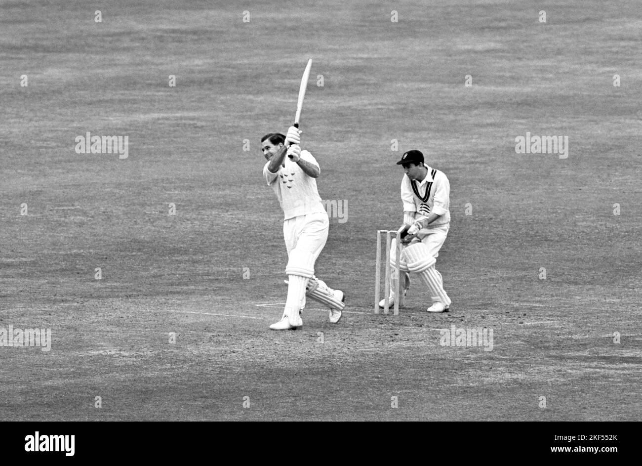 Rupert Webb of Sussex hits a ball from H. W Tilley during the match ...