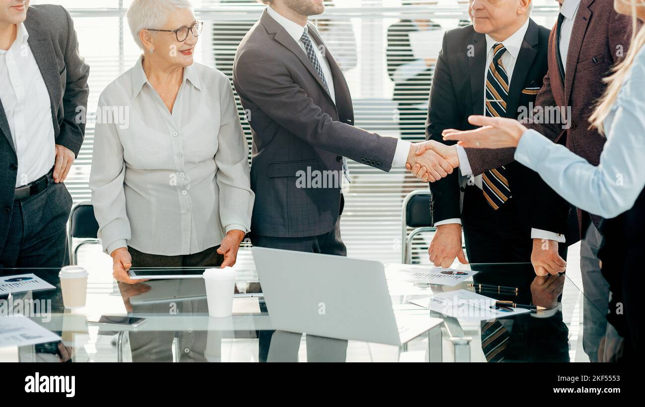business partners shaking hands before starting negotiations Stock ...