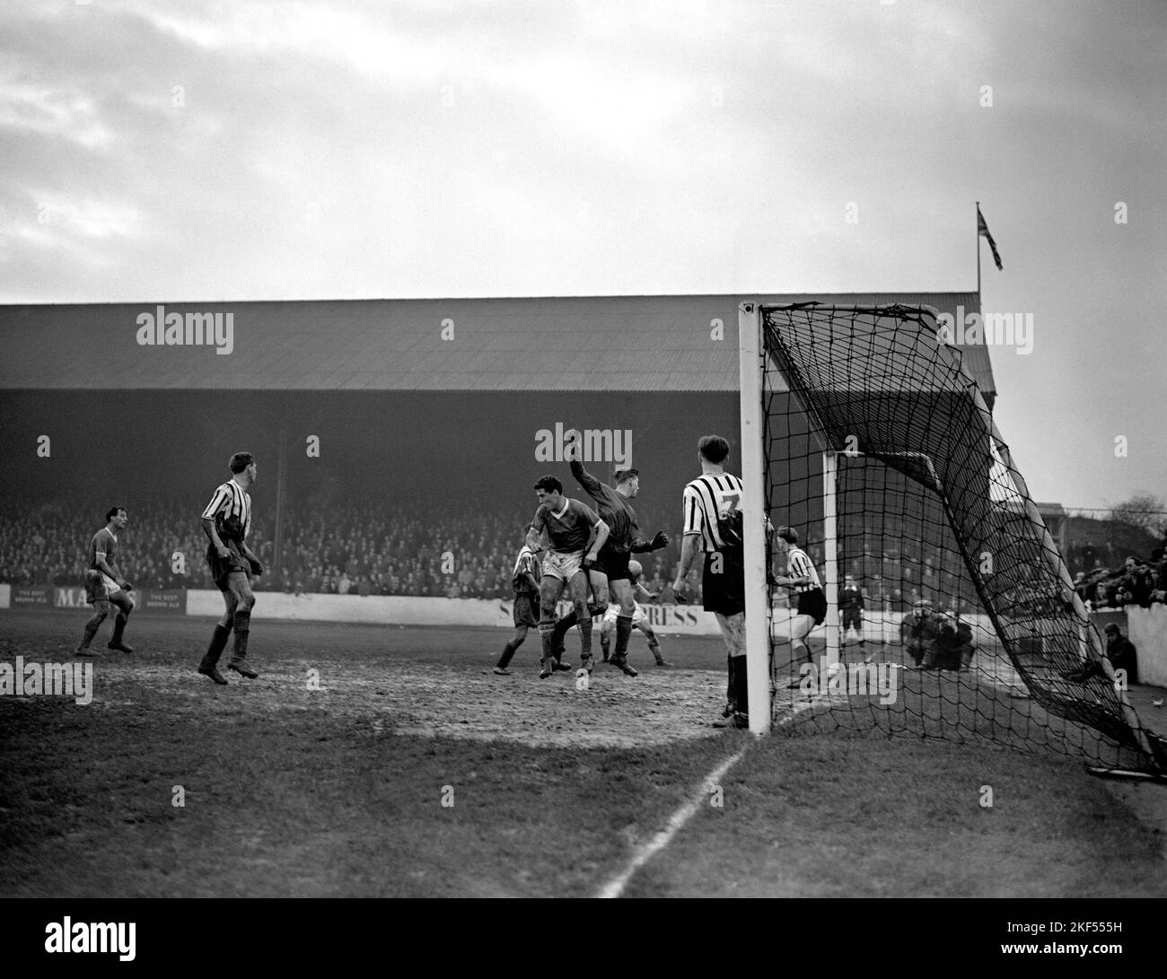 Leyton Orient's Eddie Lewis challenges Grimsby Town's goalkeeper ...