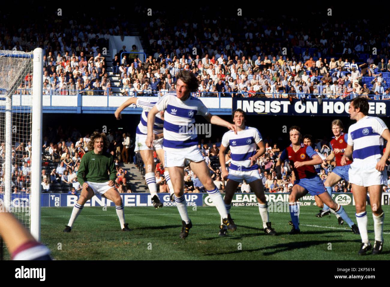 Queens Park Rangers' Stan Bowles (c) heads clear at a corner Stock ...