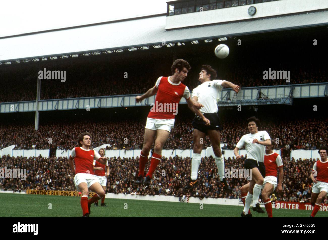 Arsenal's Brian Kidd (second l) gets in a header at goal Stock Photo ...