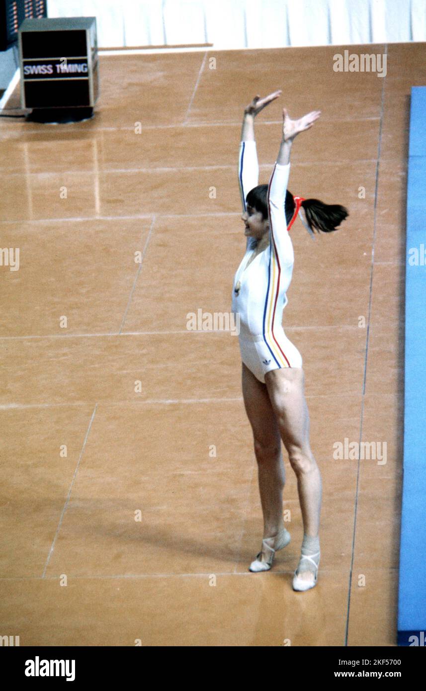 Romania's Nadia Comaneci waves to the crowd in celebration after ...