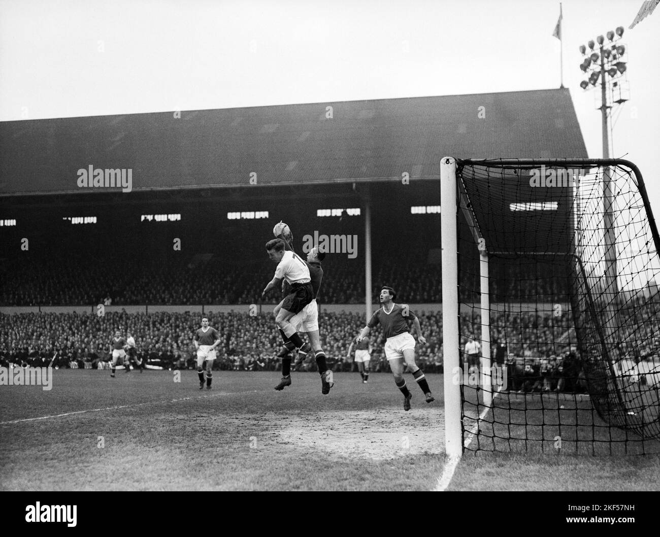 Manchester United goalkeeper Ray Wood (c) catches a cross under ...
