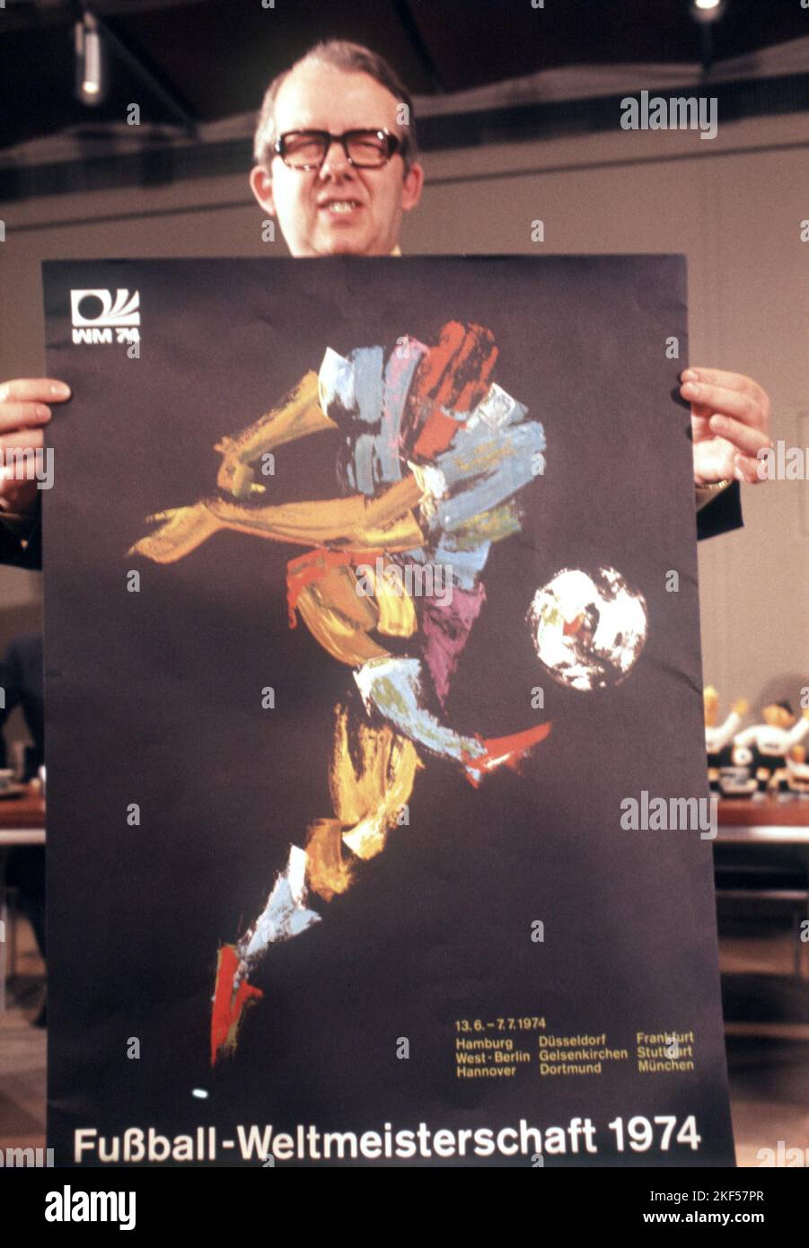 Hermann Neuberger, President of the FIFA Organising Committee, holds up ...