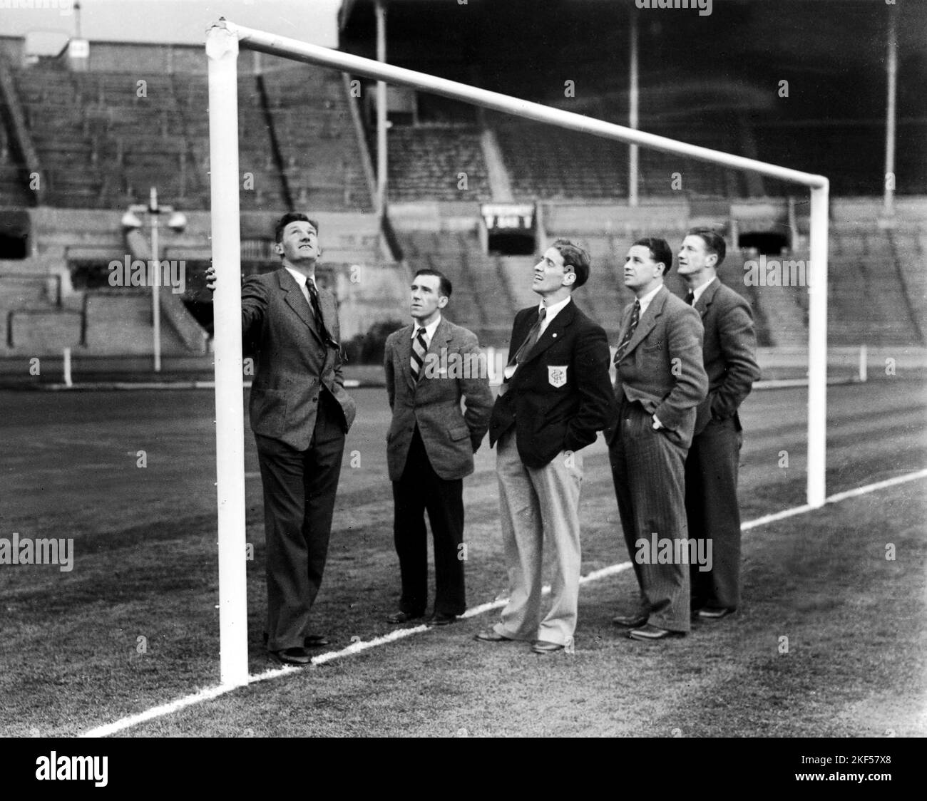 (L-R) Scotland's George Young checks the solidity of the Wembley ...