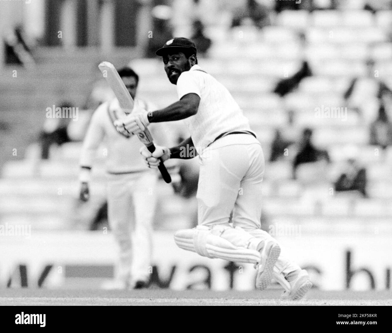 West Indies' Viv Richards takes off after edging another boundary to complete his century Stock ...