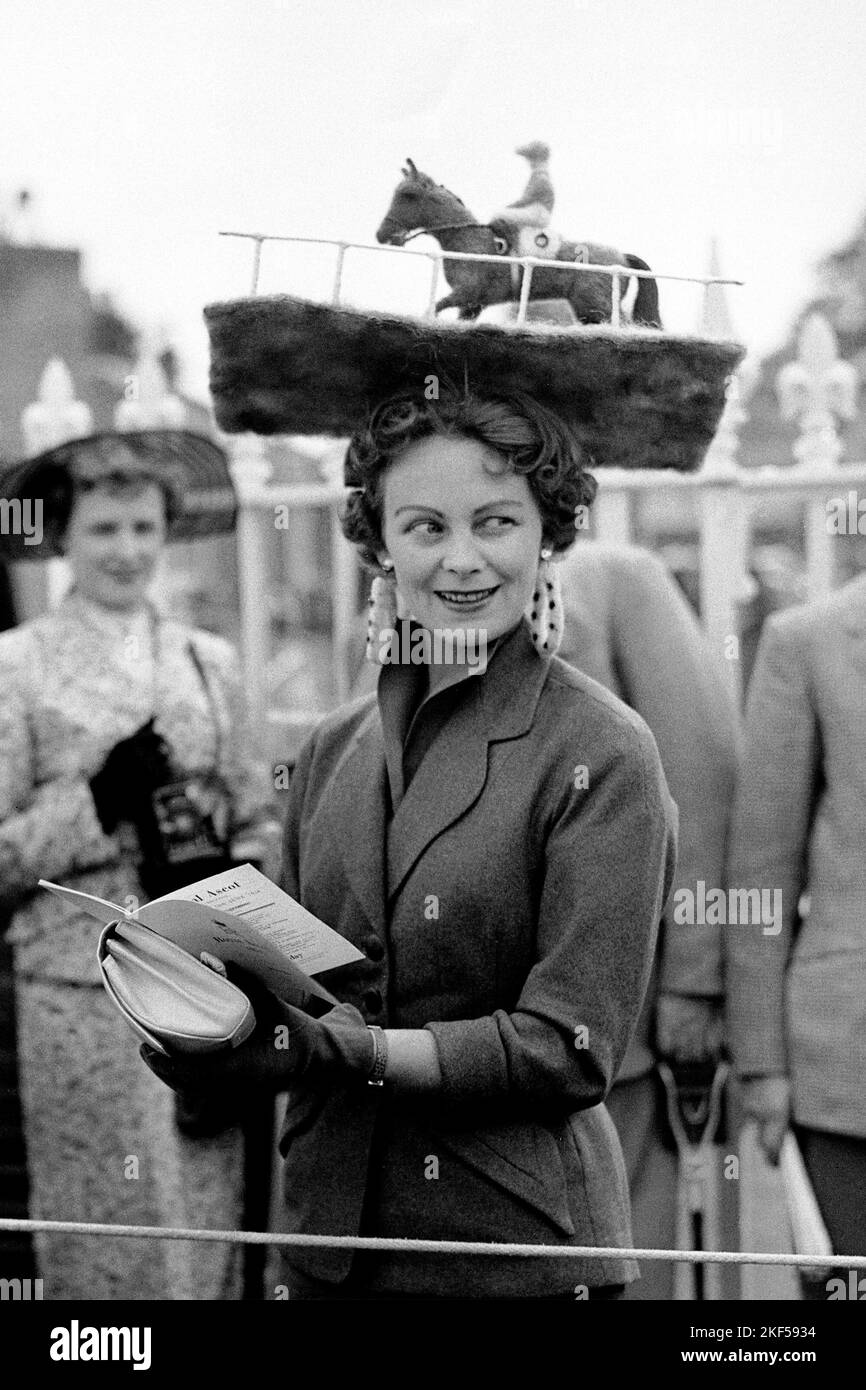 Mrs Netta Tudor, wearing a hat featuring a model racehorse at Royal ...