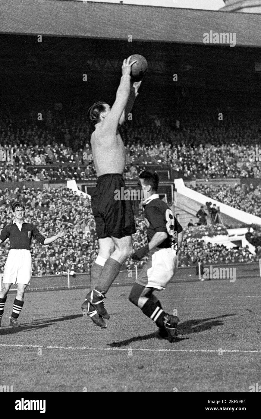 England goalkeeper Frank Swift (c) rises to claim the ball confidently ...
