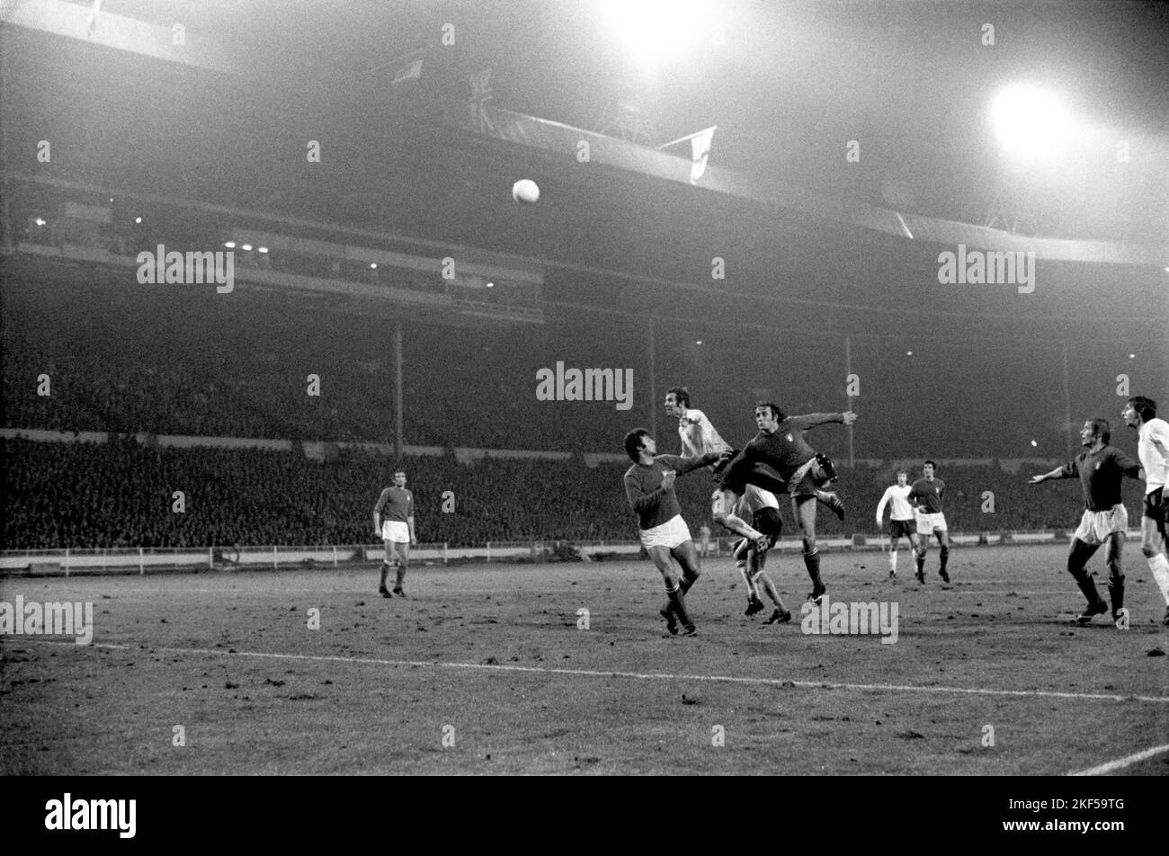 England's Peter Osgood rises above Italy's Giacinto Fachetti and ...
