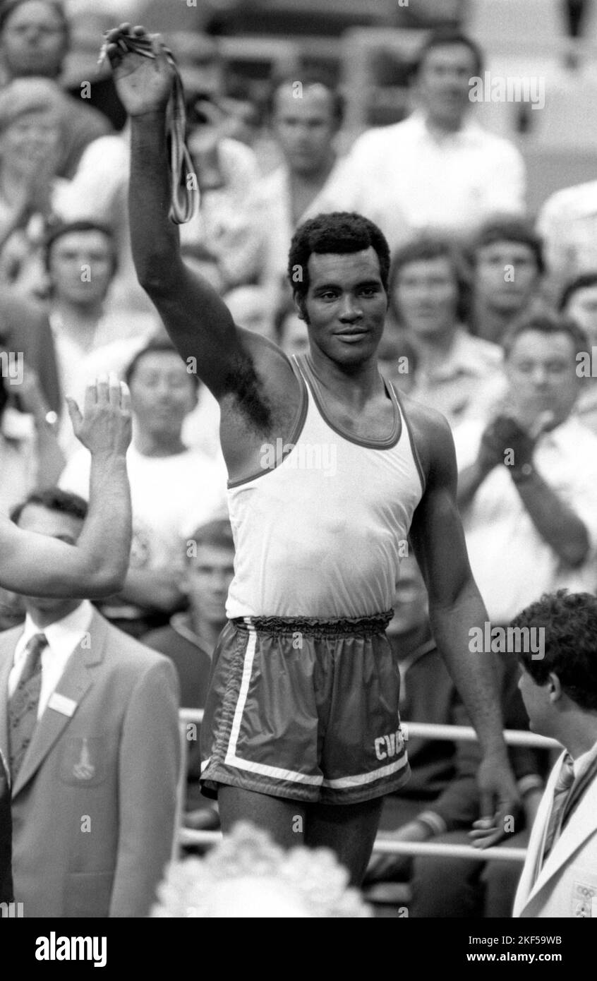 Cuba's Teofilo Stevenson holds his gold medal aloft in celebration ...
