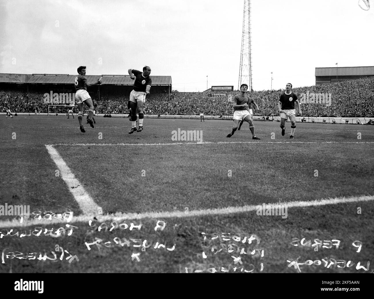 (L-R) Chelsea's Bobby Tambling flicks the ball over Liverpool's Ronnie ...