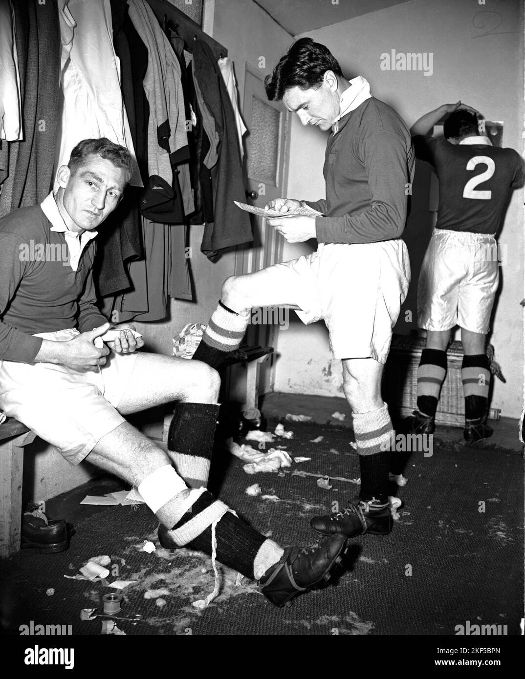 (L-R) Chelsea's Roy Bentley bandages his shin, as teammate Ken ...