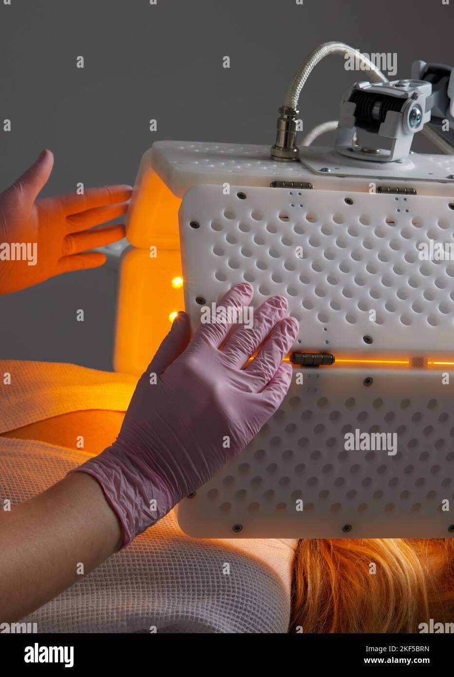 Young woman having photodynamic therapy in beauty salon Stock Photo - Alamy