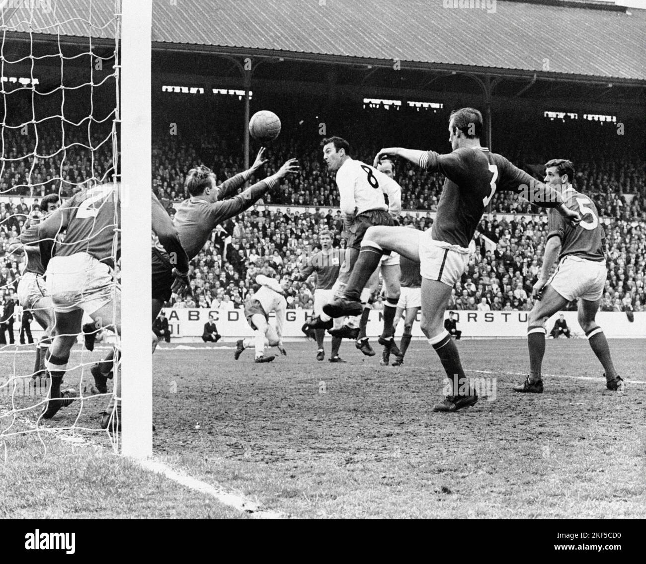Nottingham Forest goalkeeper Peter Grummitt (third l) saves from ...