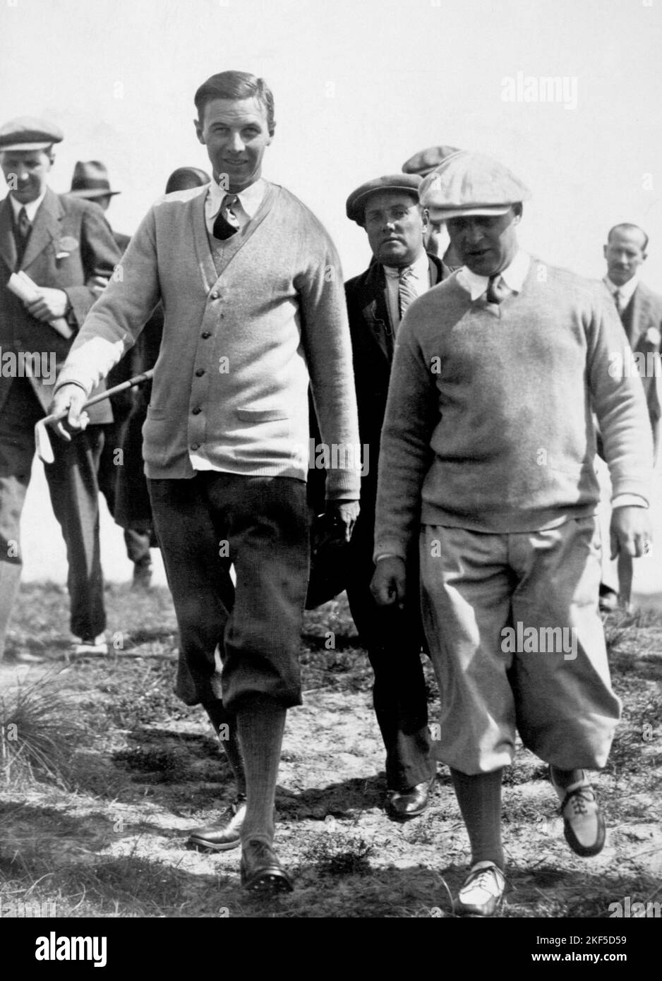 (L-R) The two captains, Roger Wethered and USA's Bobby Jones, walk to ...