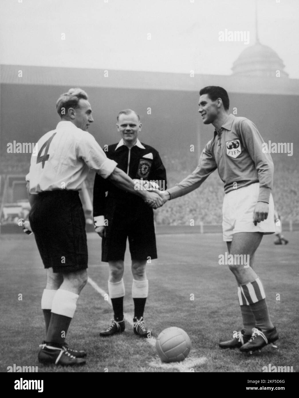 England captain Billy Wright (l) shakes hands with Rest of the World ...