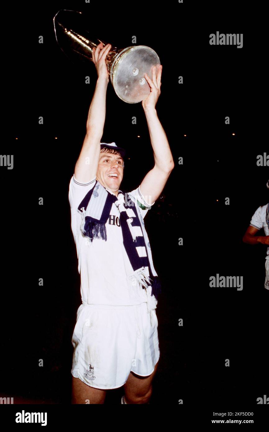 Tottenham Hotspur captain Graham Roberts lifts the UEFA Cup following ...