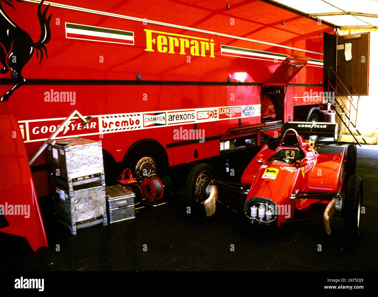 A Ferrari on park wheels and the technicians behind the scenes Stock ...