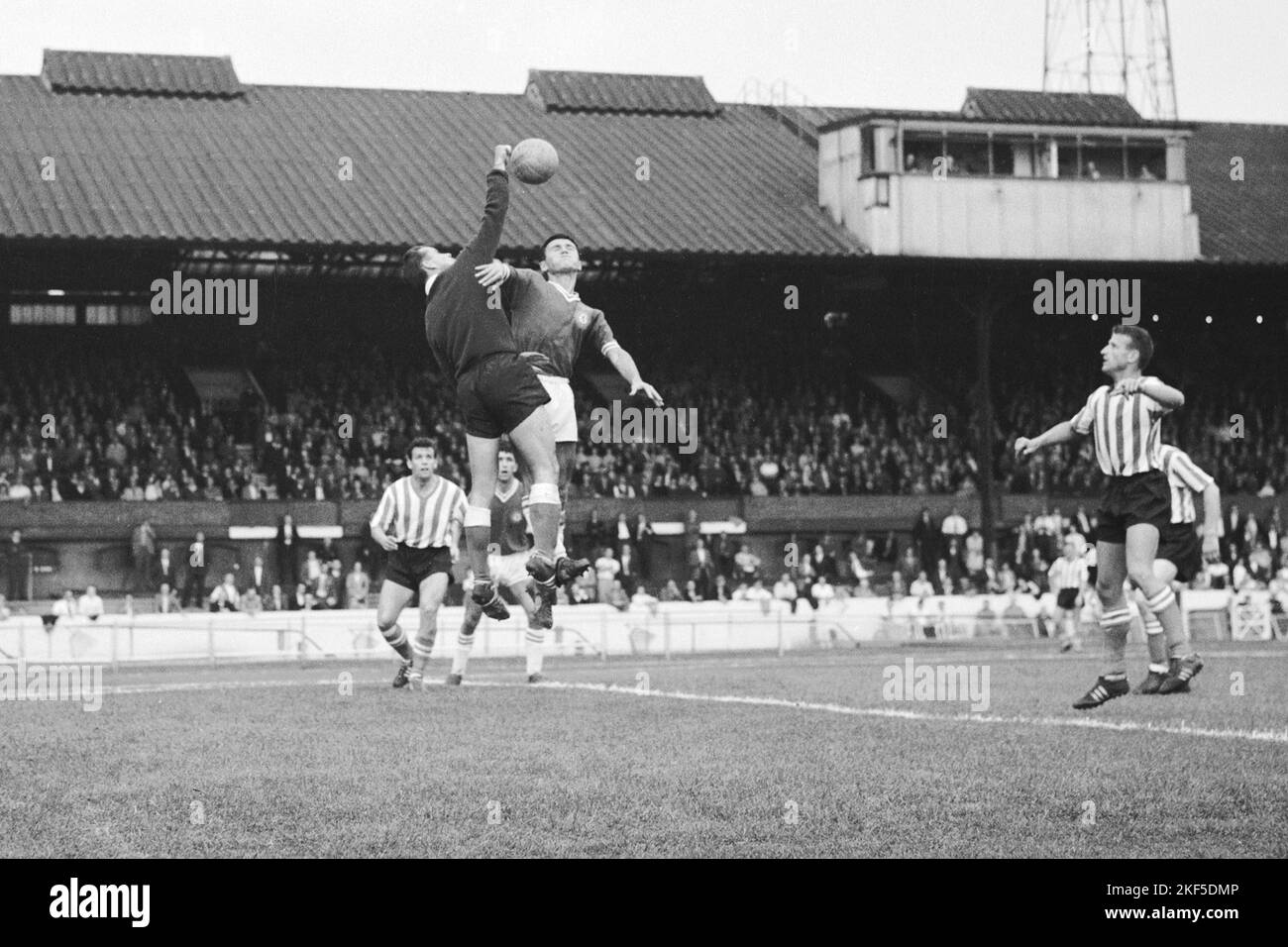 (L-R) Sheffield United goalkeeper Alan Hodgkinson punches clear from ...