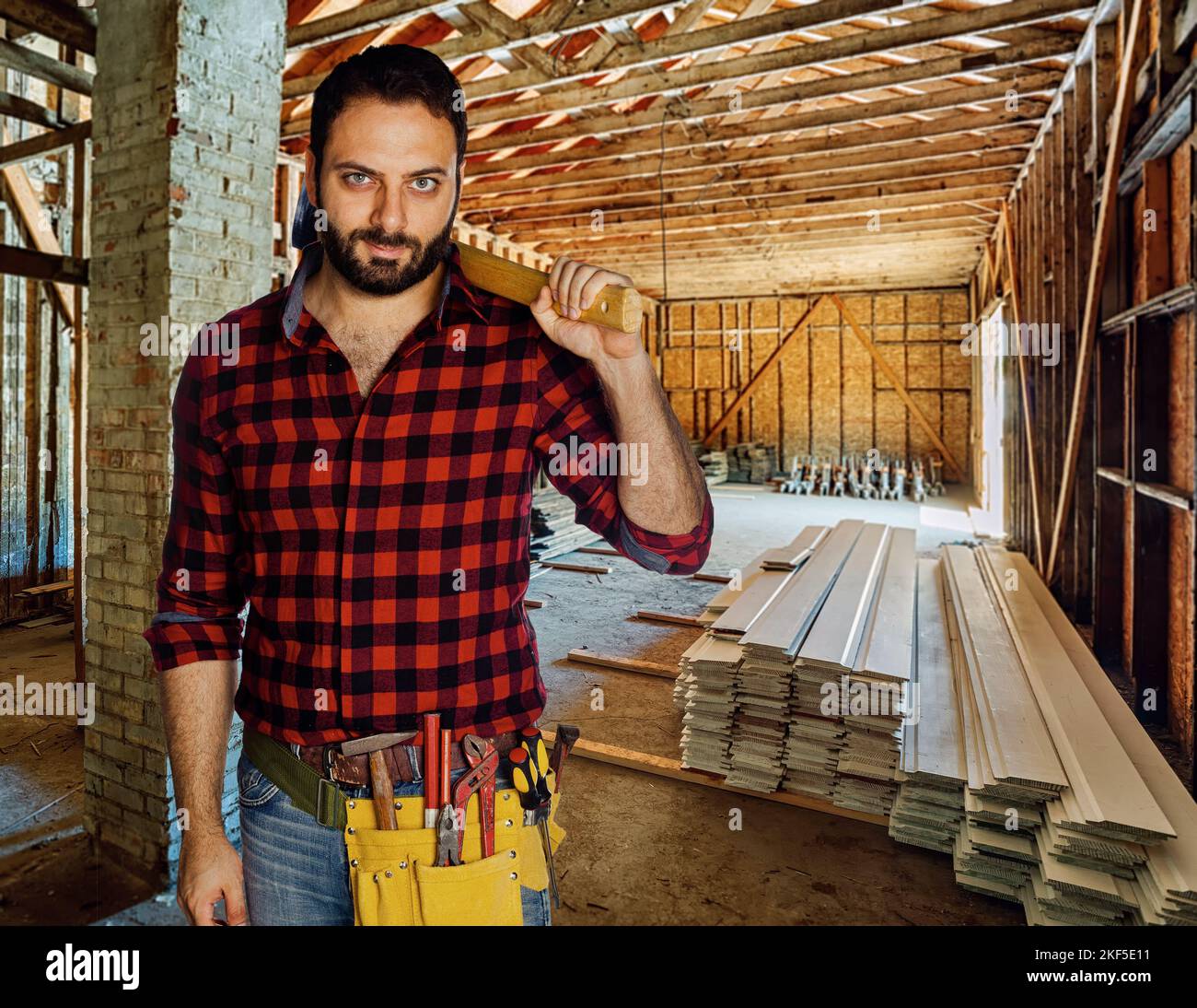 Portrait of a carpenter in a wooden house under construction Stock ...