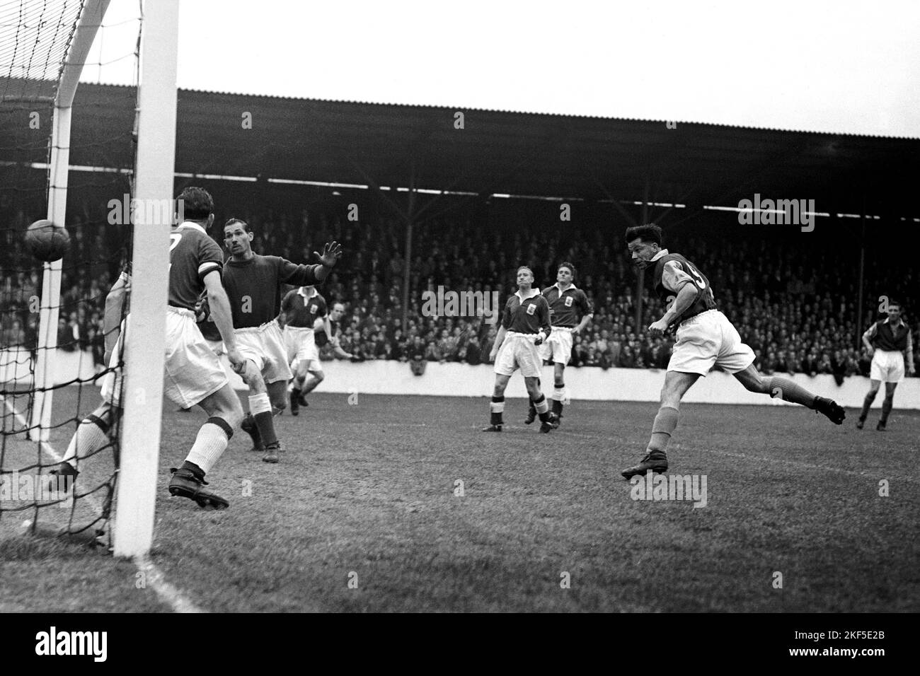 West Ham United's Tommy Moroney (r) heads the opening goal past ...