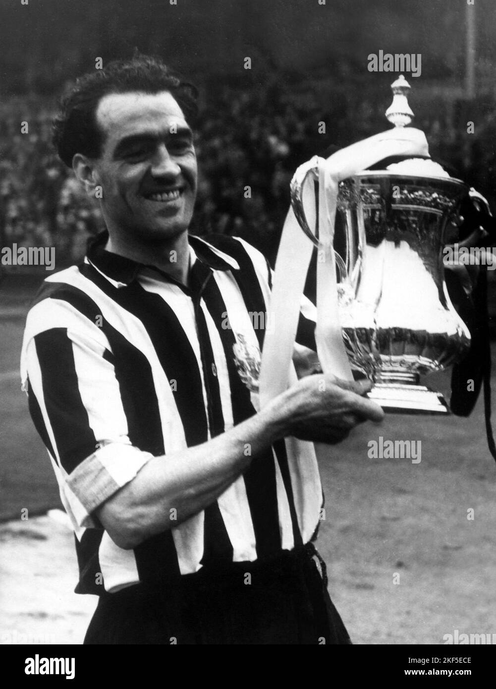Newcastle United captain Joe Harvey shows off the FA Cup after his team ...