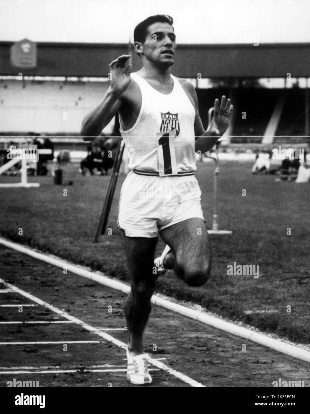 USA's Jim Beatty breaks the tape to win the men's mile in 3m59.7s Stock ...