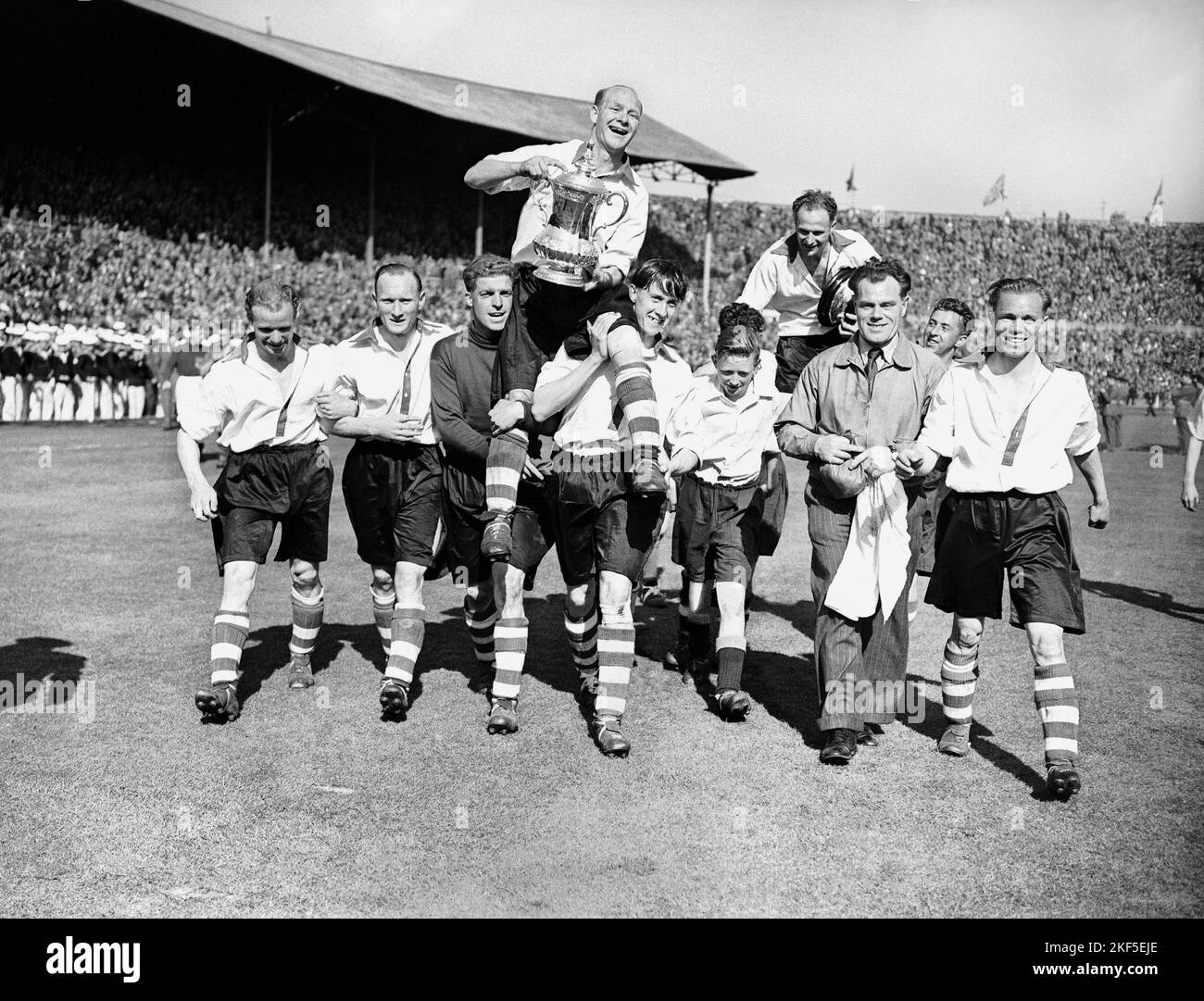 Charlton Athletic captain Don Welsh, holding the FA Cup, and winning ...