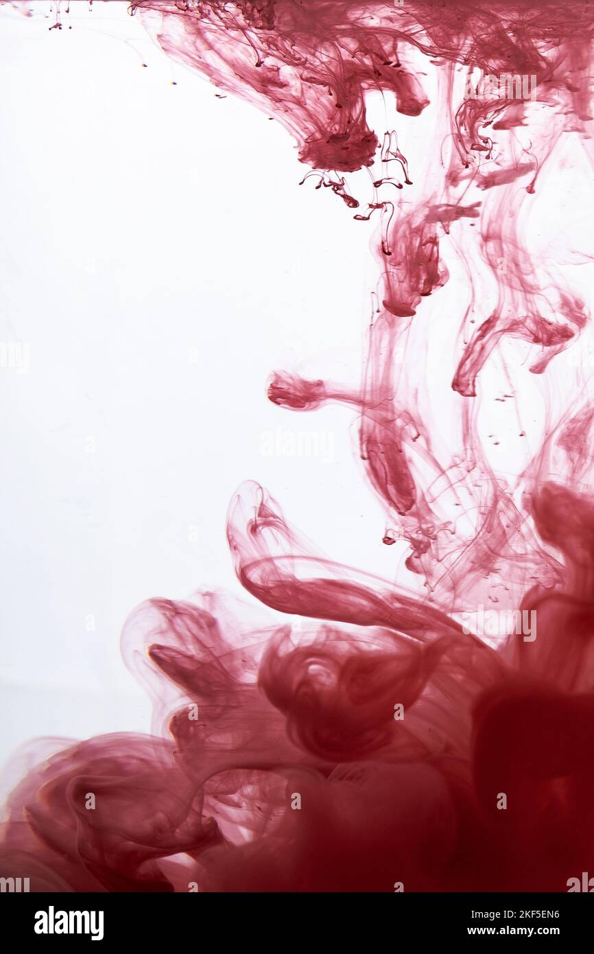 Red color flowing in smoke forms, smooth abstract moving by acrylic ...