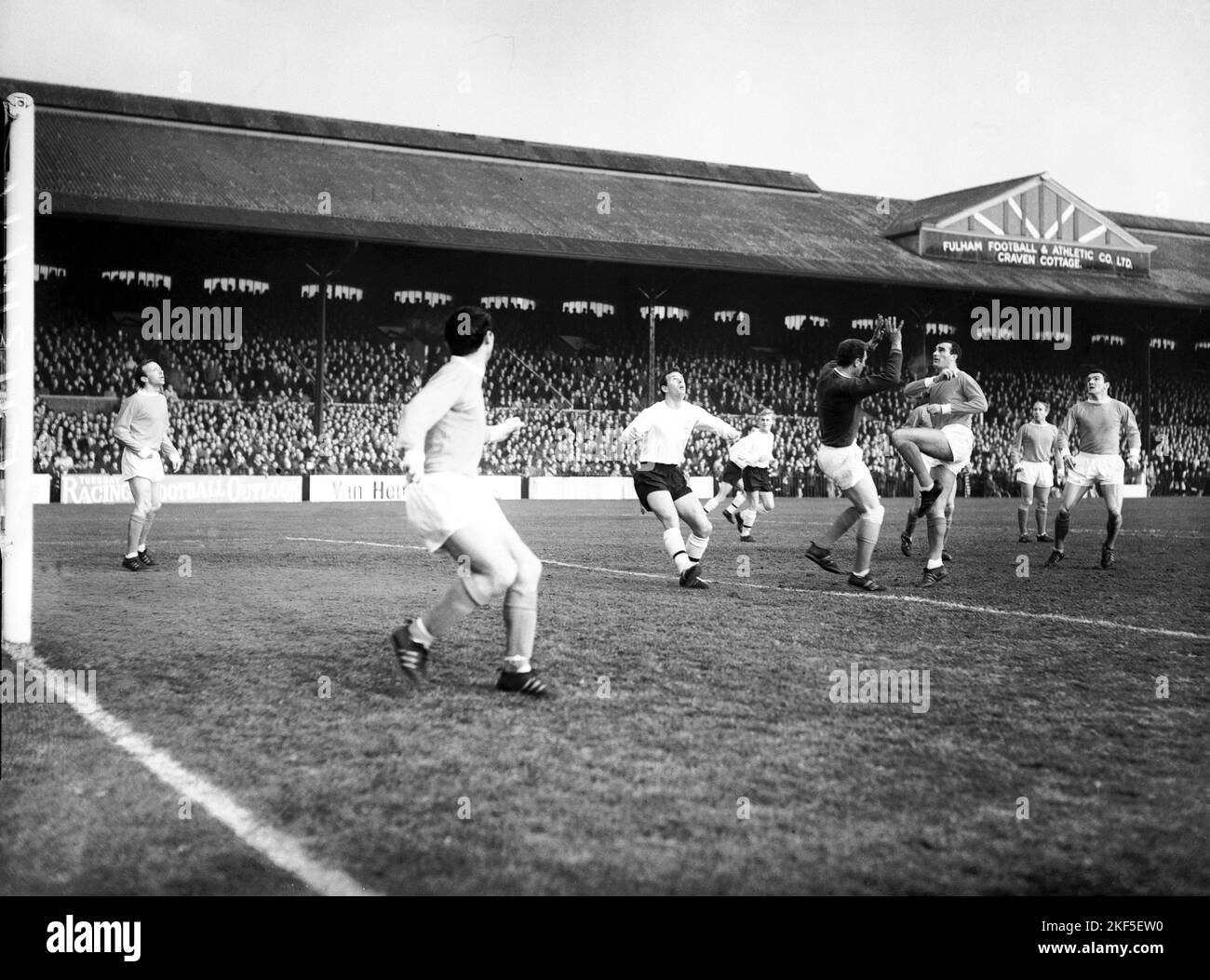 Manchester United's Noel Cantwell (second r) clears the ball vertically ...