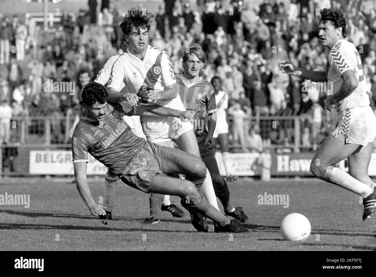 (L-R) Wimbledon's Steve Hatter tackles Crystal Palace's Jerry Murphy ...