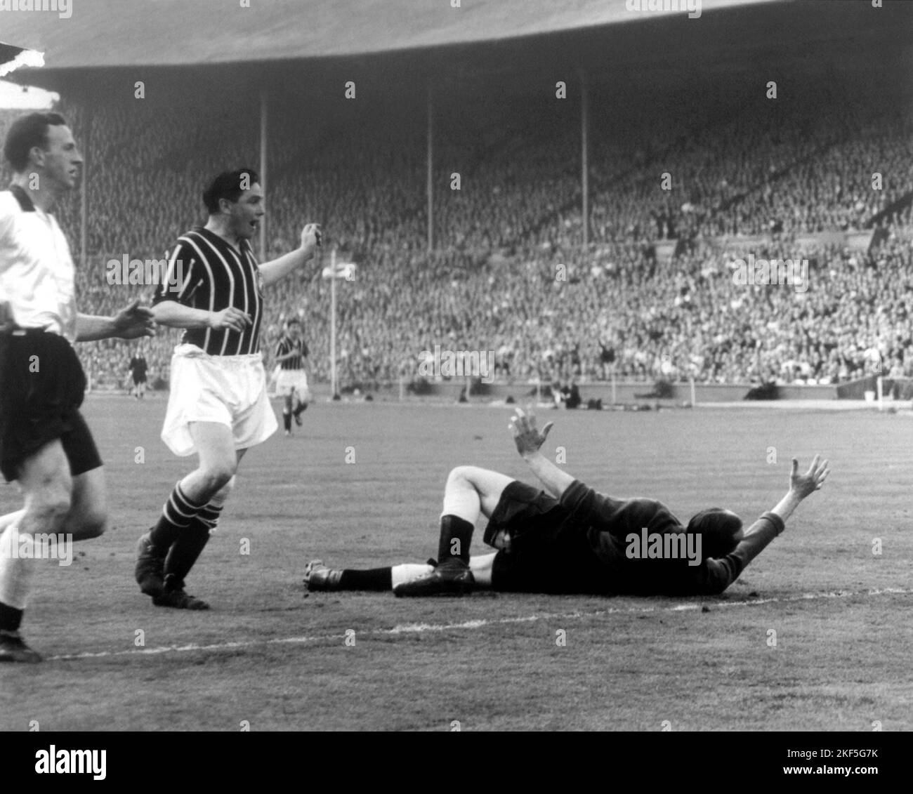 Manchester City's Bobby Johnstone (c) beats Birmingham City goalkeeper ...