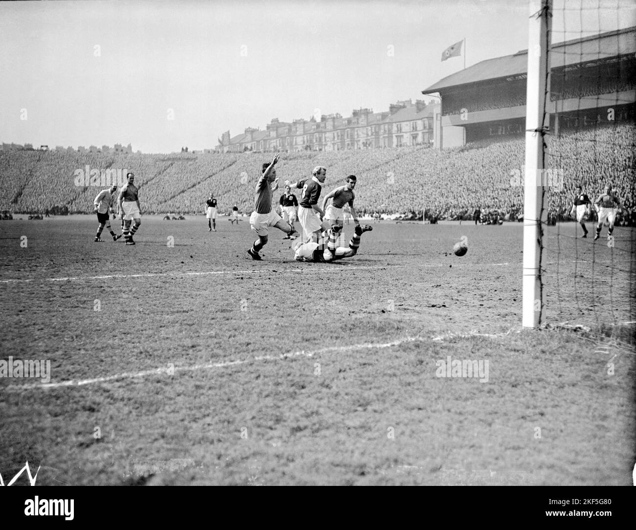 Great Britain's Wilf Mannion (c) prods the opening goal past Rest of ...