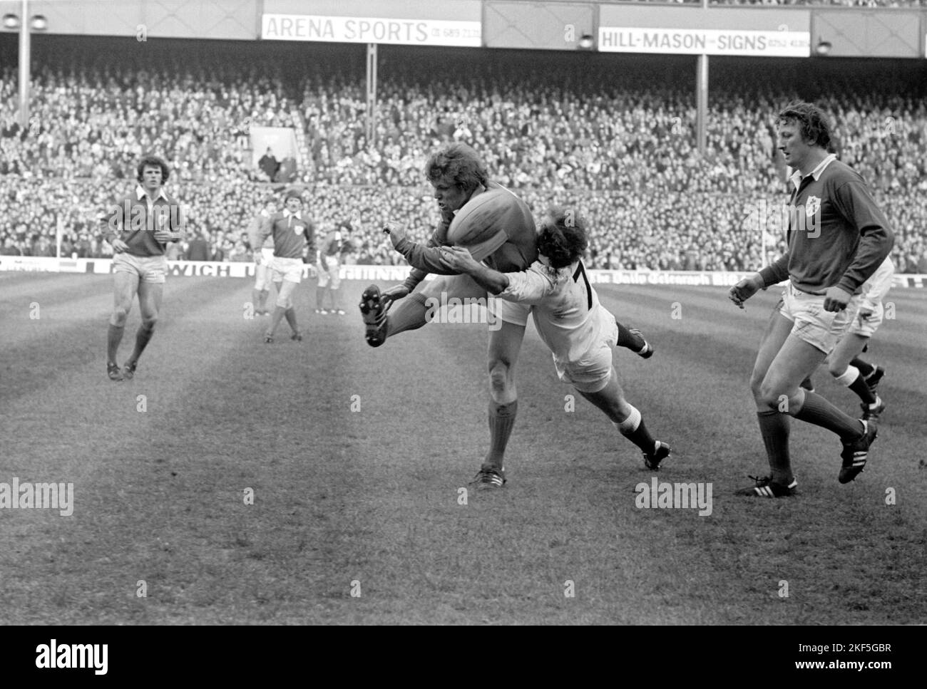 (L-R) Ireland's Fergus Slattery kicks the ball away as England's Mike ...