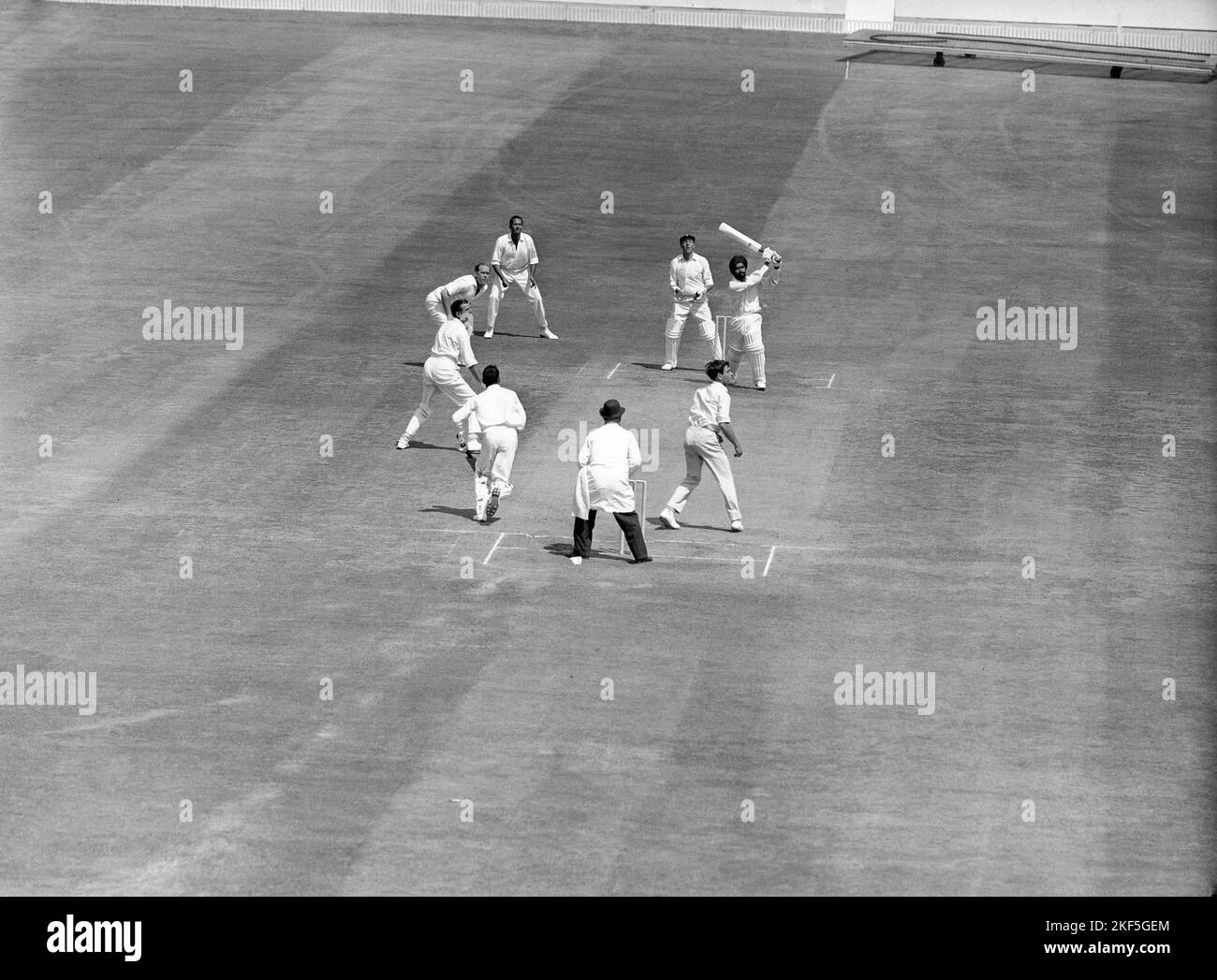 India's Bishan Bedi (top r) lofts the ball to the boundary, watched by ...