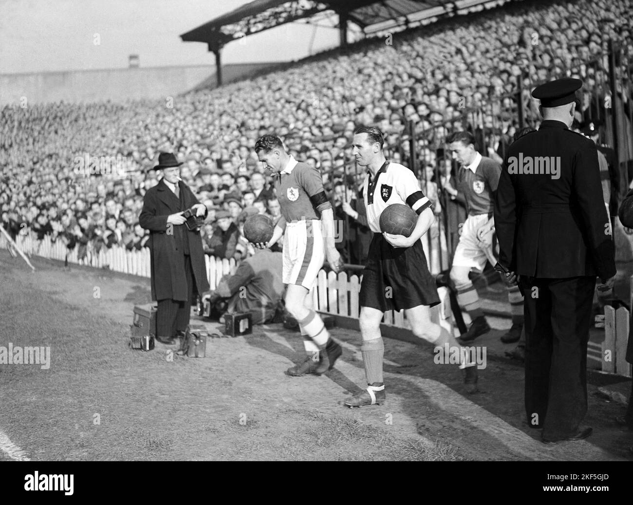 (L-R) The two captains lead their teams out before the match, Millwall ...