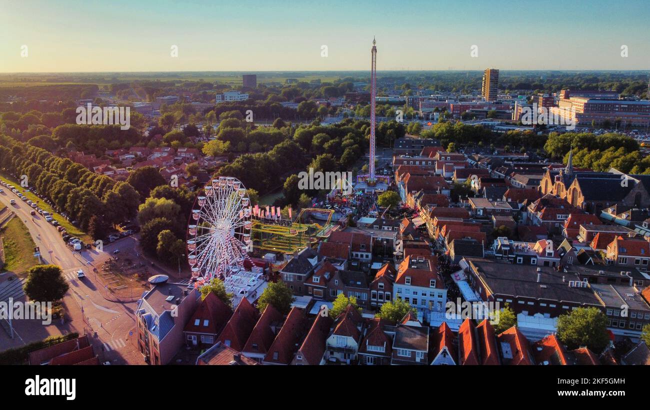 An aerial shot of the buildings and park of attractions at Funfair ...