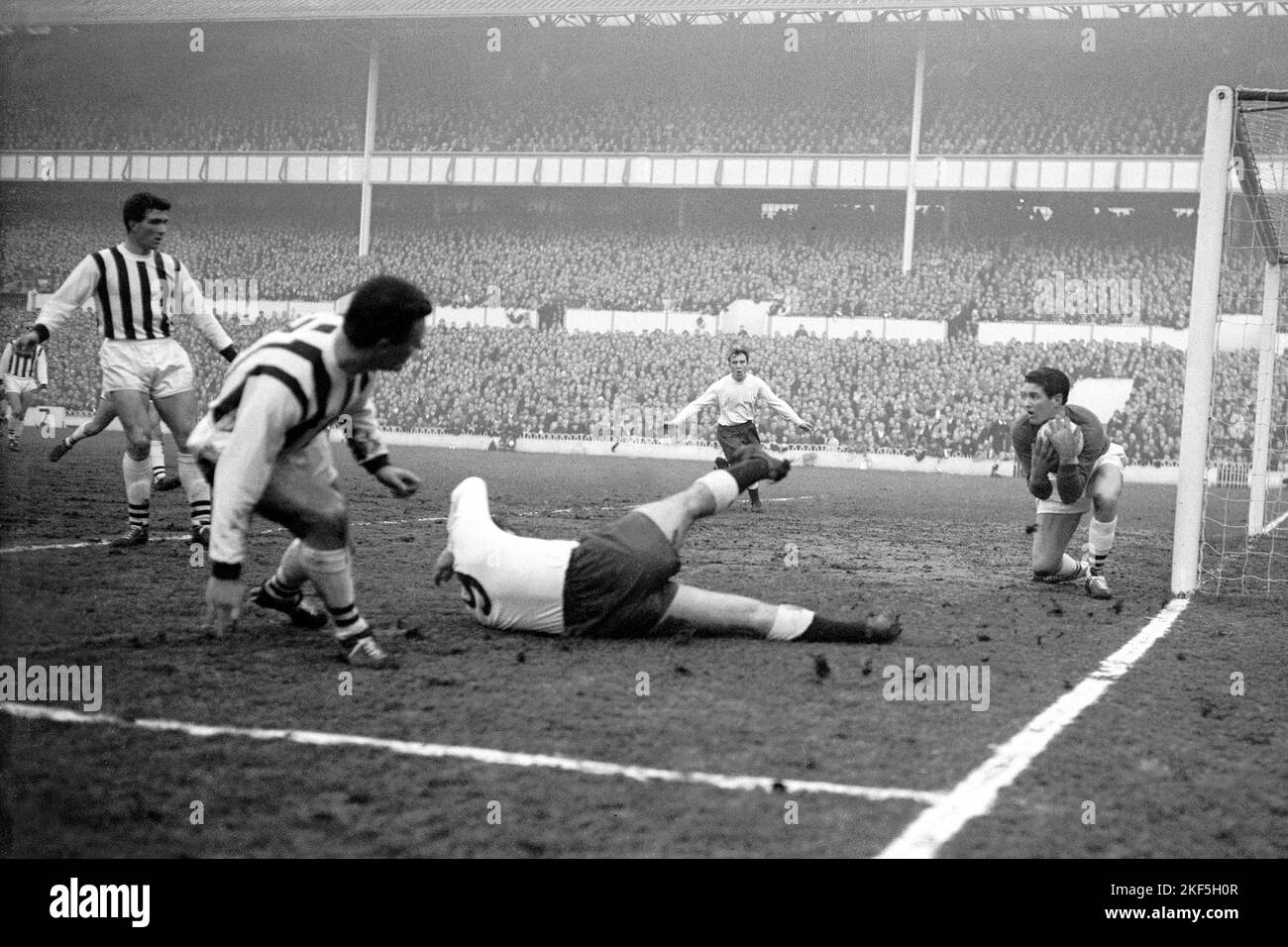 West Bromwich Albion goalkeeper Ray Potter (r) saves at his near post ...